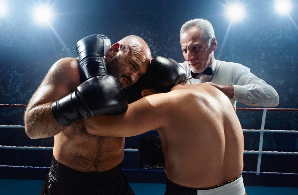 Why Do People Hug in Boxing? - Casino.org Blog